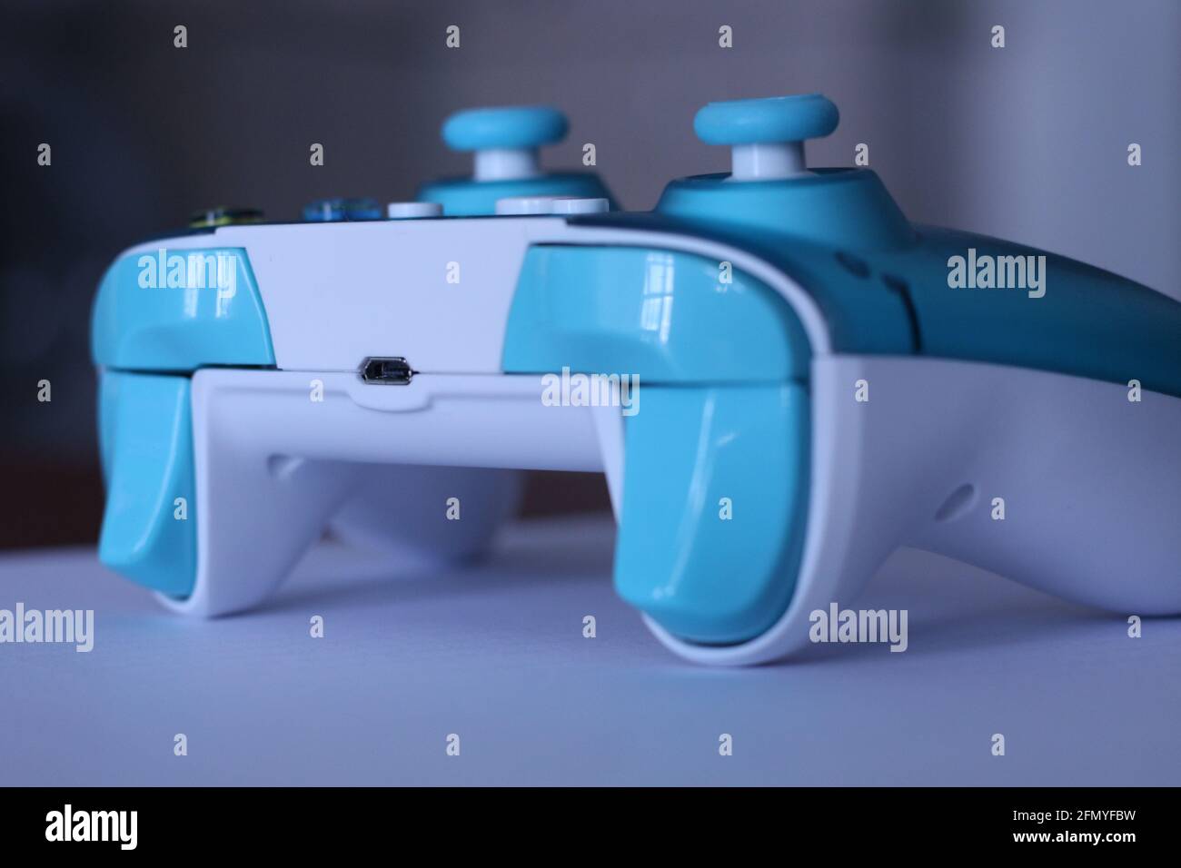 In this photo illustration, the back view of a a generic controller for ...