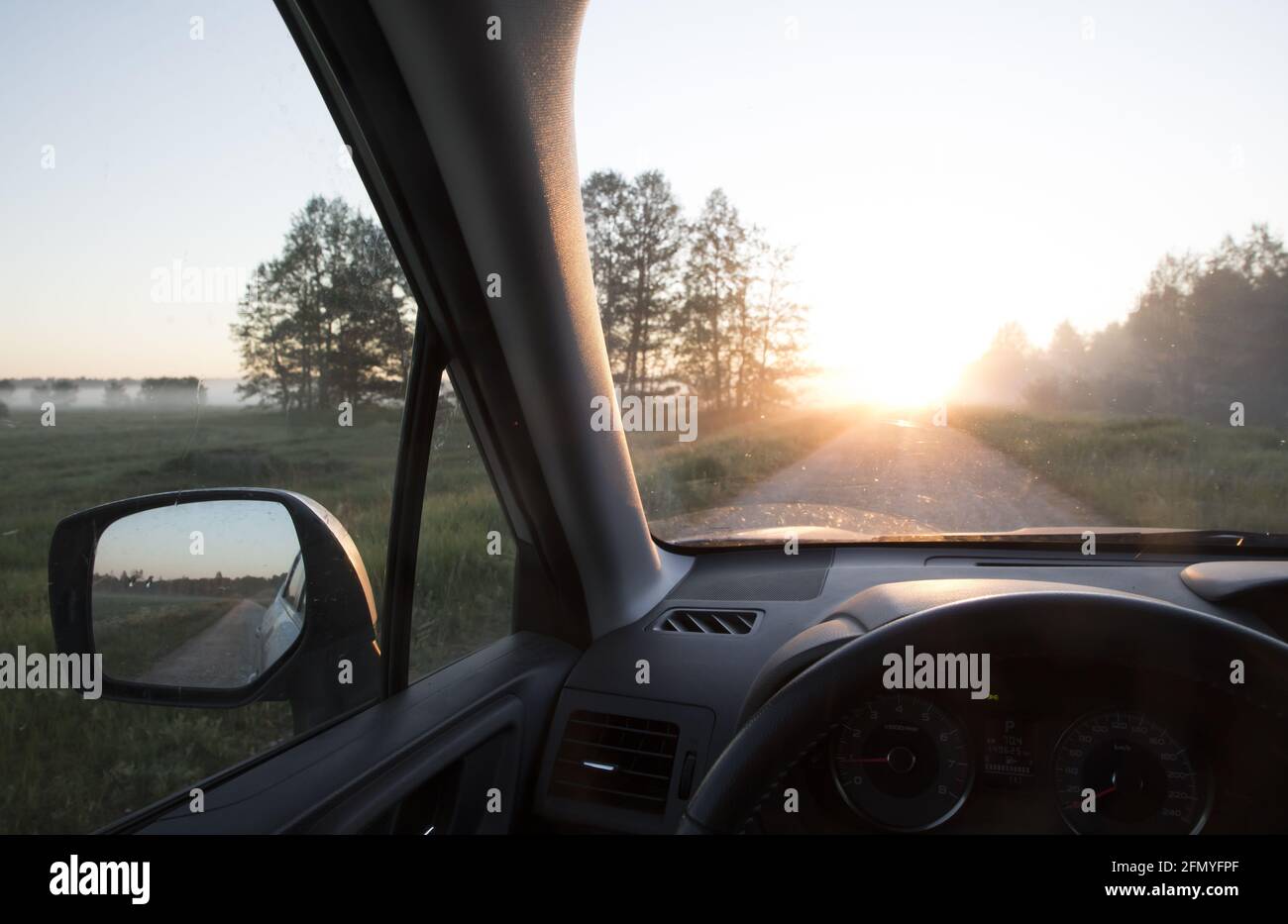 View of a peaceful road from inside a car at sunset Stock Photo - Alamy