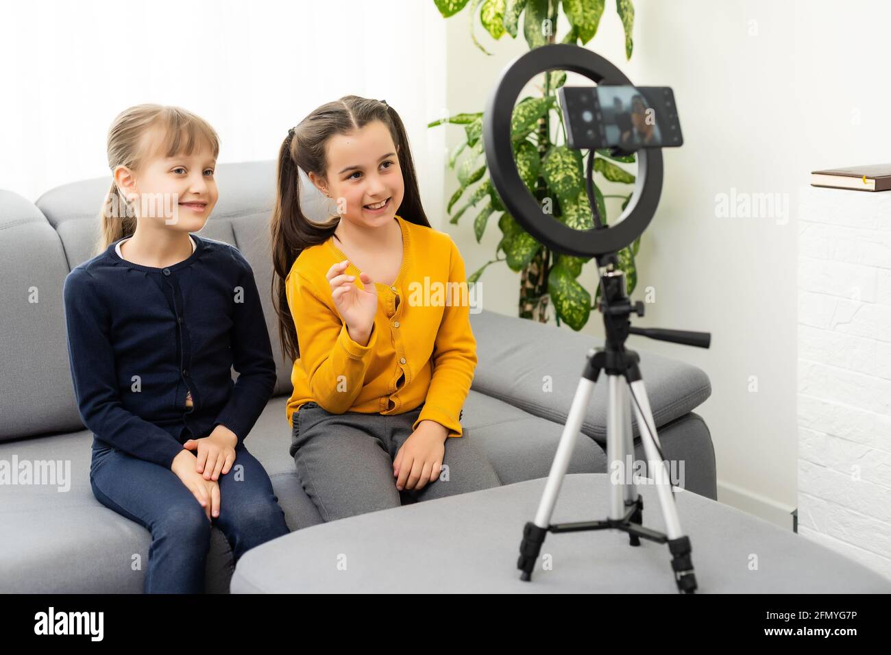 Close up photo two little girls take selfies, talk, tell, speak Stock ...