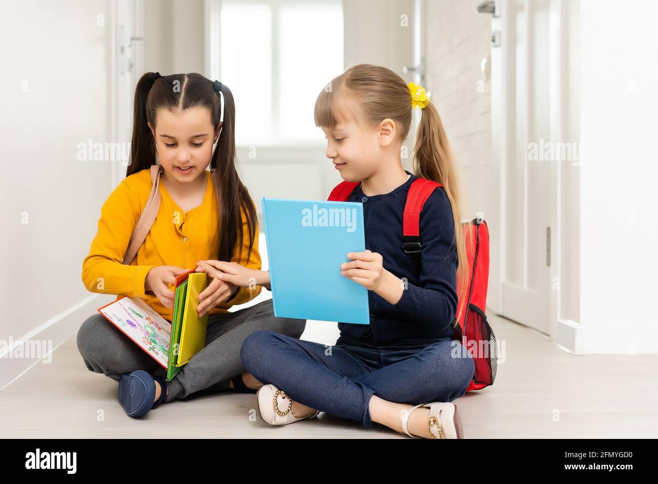 Two pupils of elementary school, Back to school Stock Photo - Alamy
