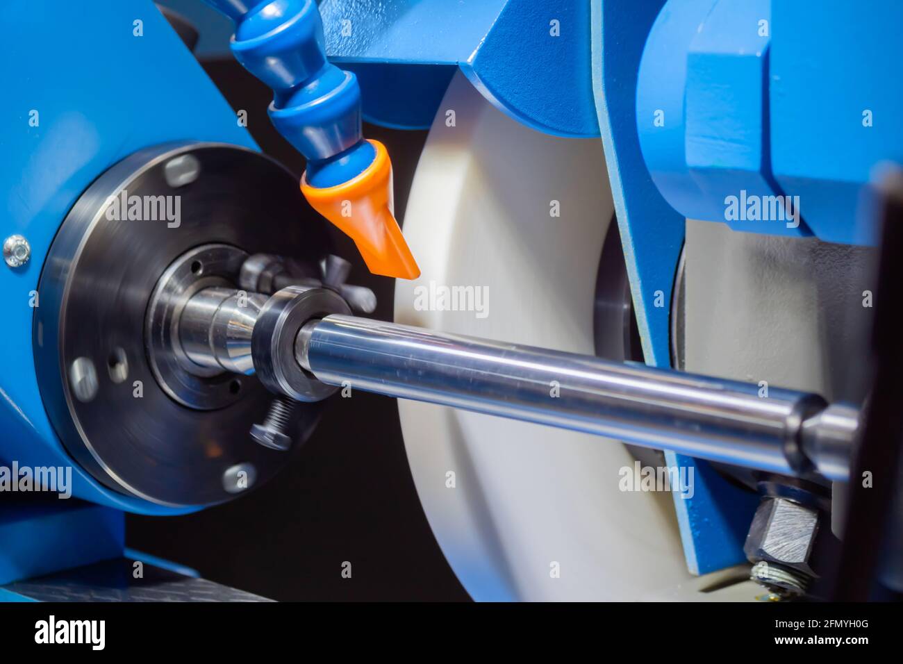 Surface grinding wheel machine working with metal workpiece at factory ...