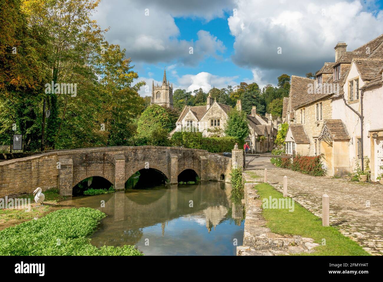 View of village and River Bybrook, Castle Combe, Wiltshire, England ...