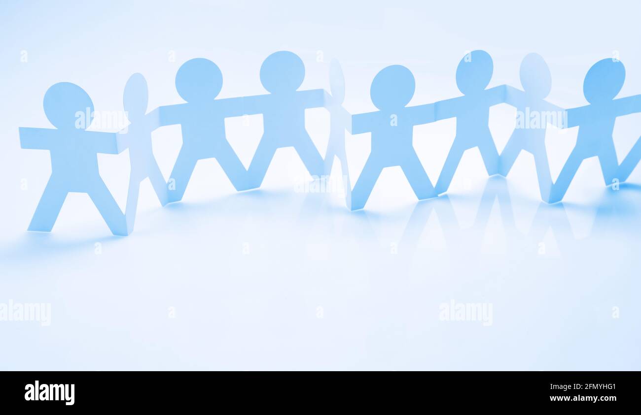 Team of paper chain people Stock Photo - Alamy