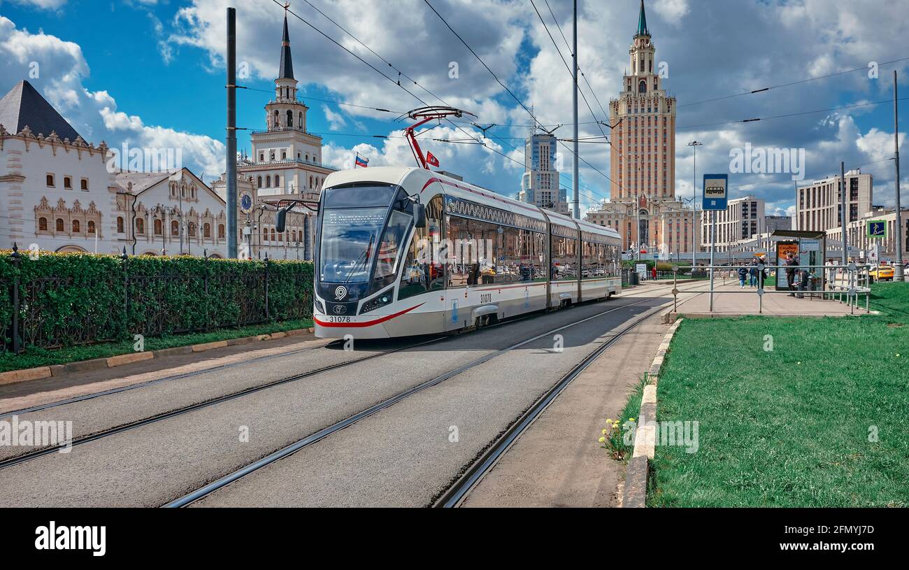 City modern tram on a street of Moscow, urban passenger transport ...
