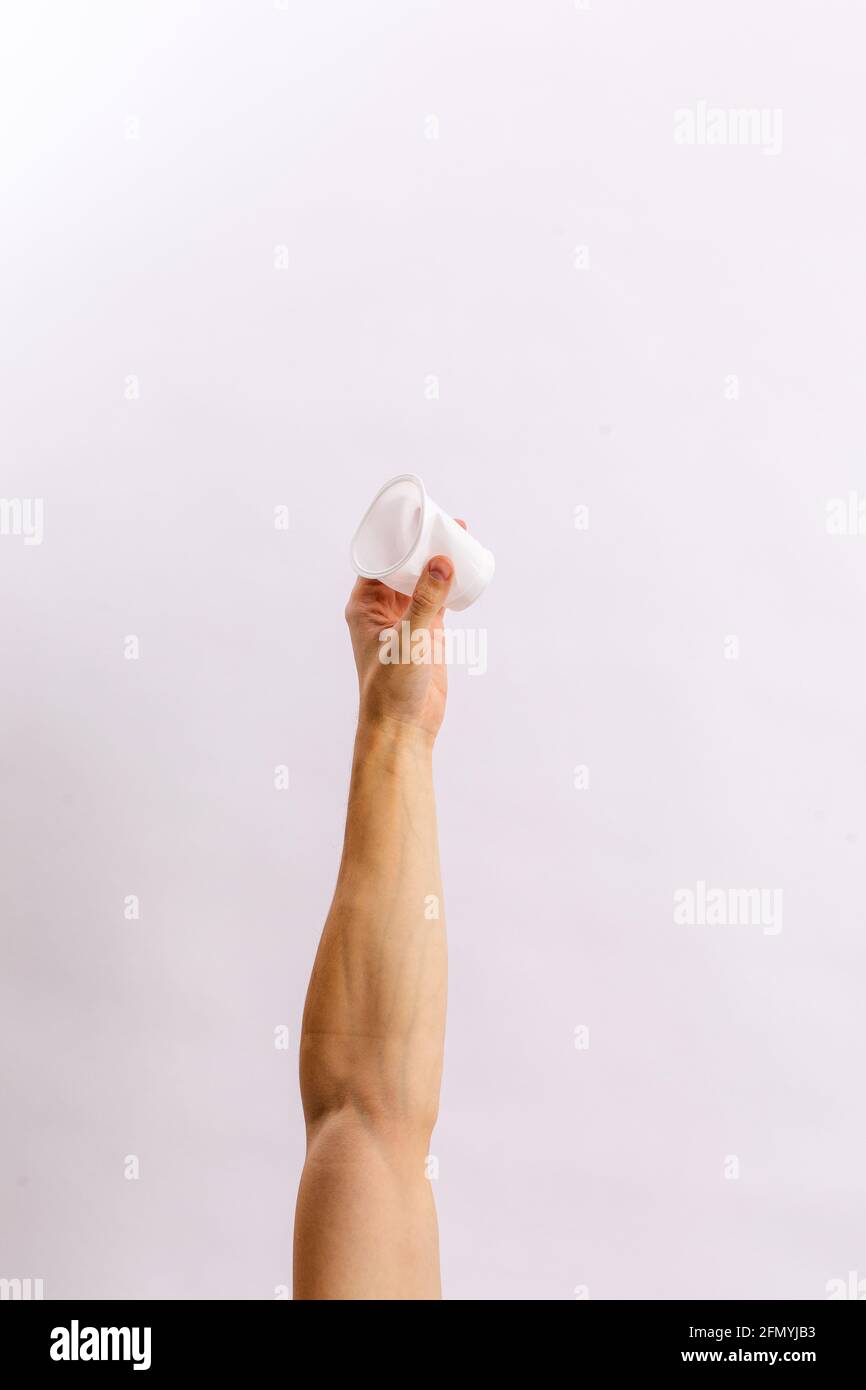 Hands hold trash on a light background. The concept of separate trash ...