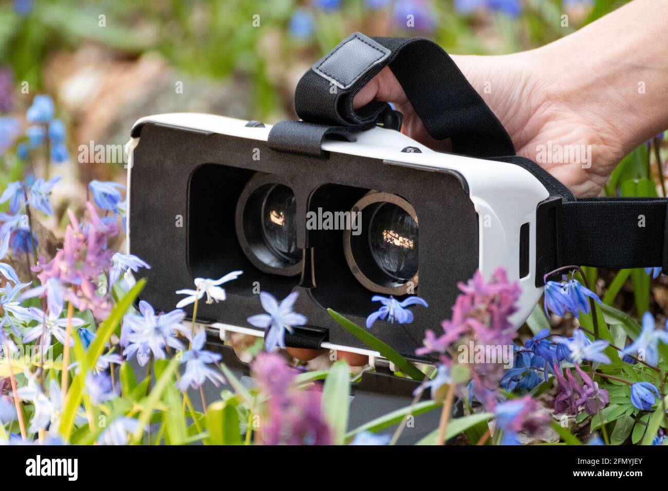 Hand holding 3D Virtual reality headset glasses with lens front part ...