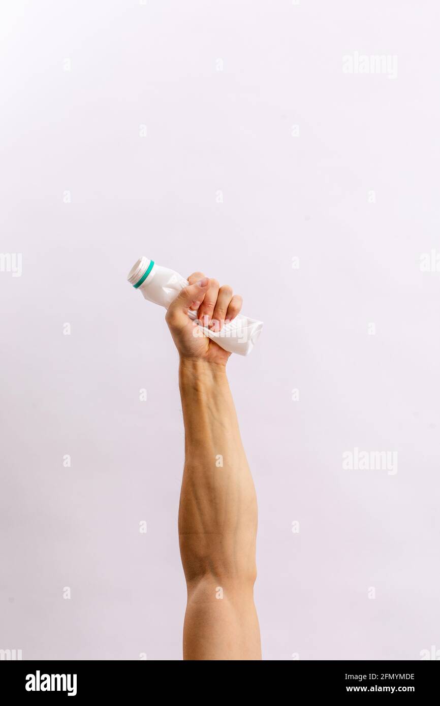 Hands hold trash on a light background. The concept of separate trash ...