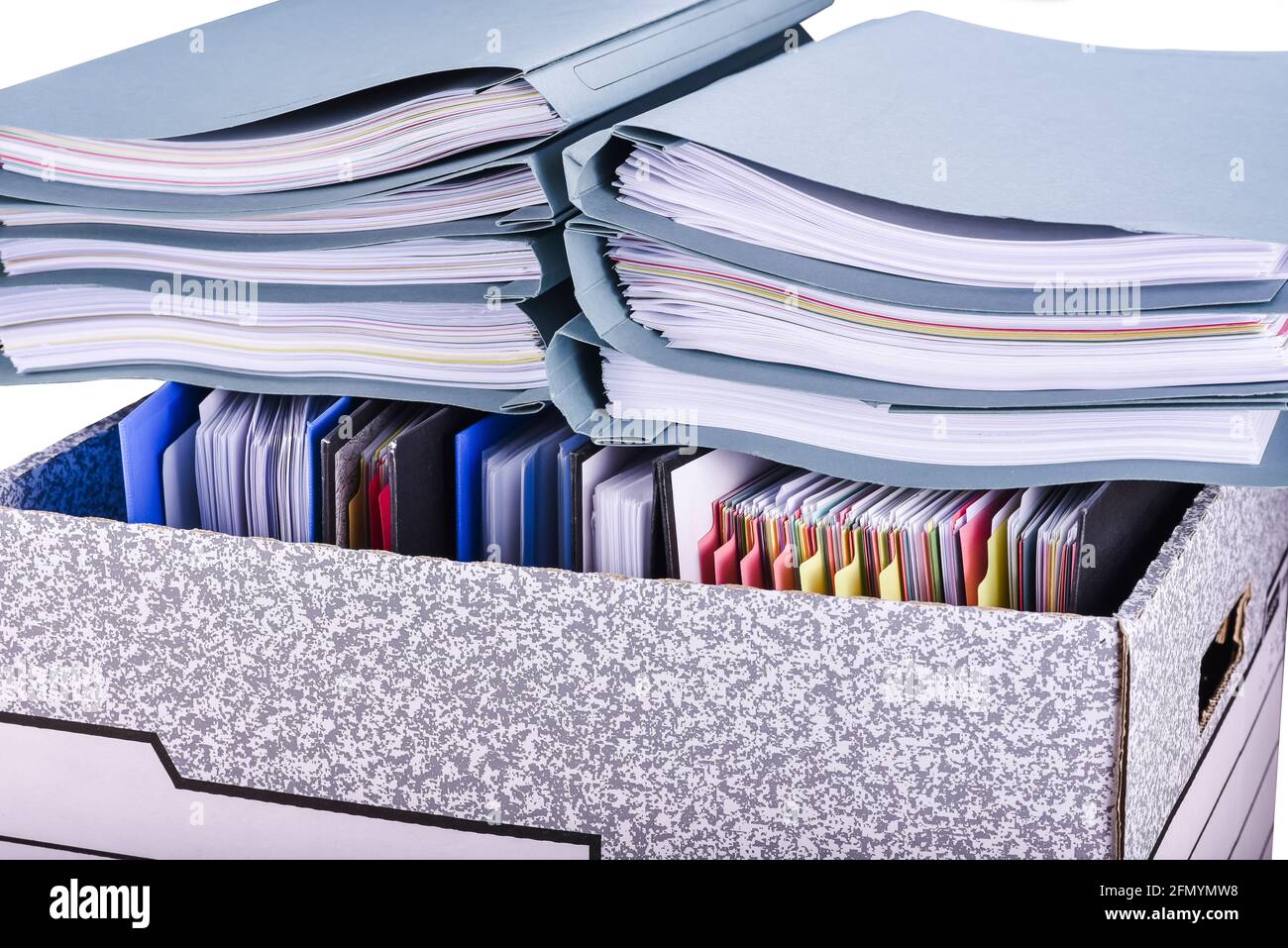 Documents and files folders are placed in a paper box and pile of extra ...