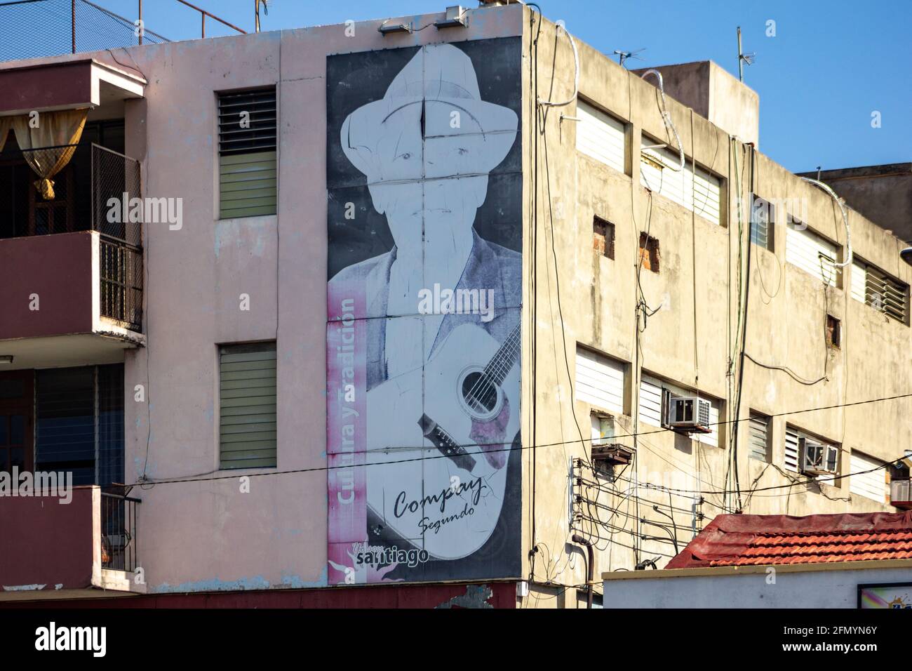 Apartment building with cultural billboard about Compay Segundo in ...