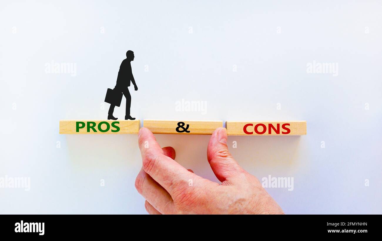 Pros and cons symbol. Wooden blocks with words 'Pros and cons ...