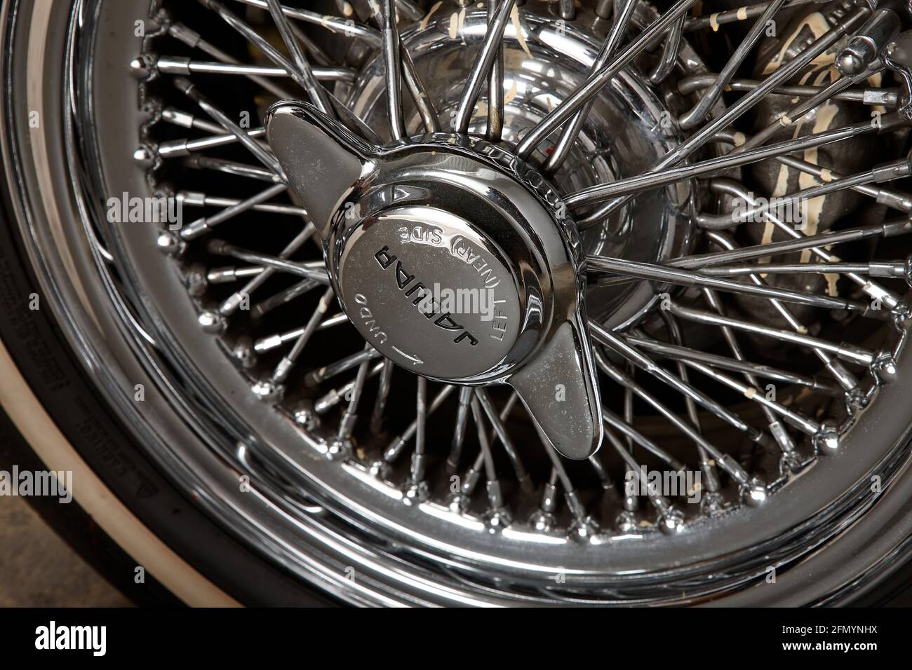 Jaguar E Type wheel with characteristic spikes and a central nut - an ...
