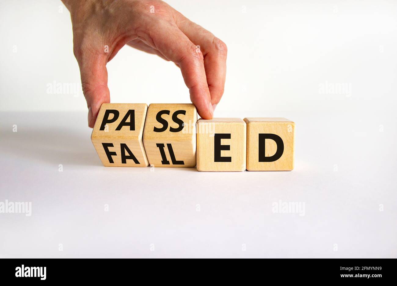 Passed or failed symbol. Businessman turns wooden cubes and changes the ...