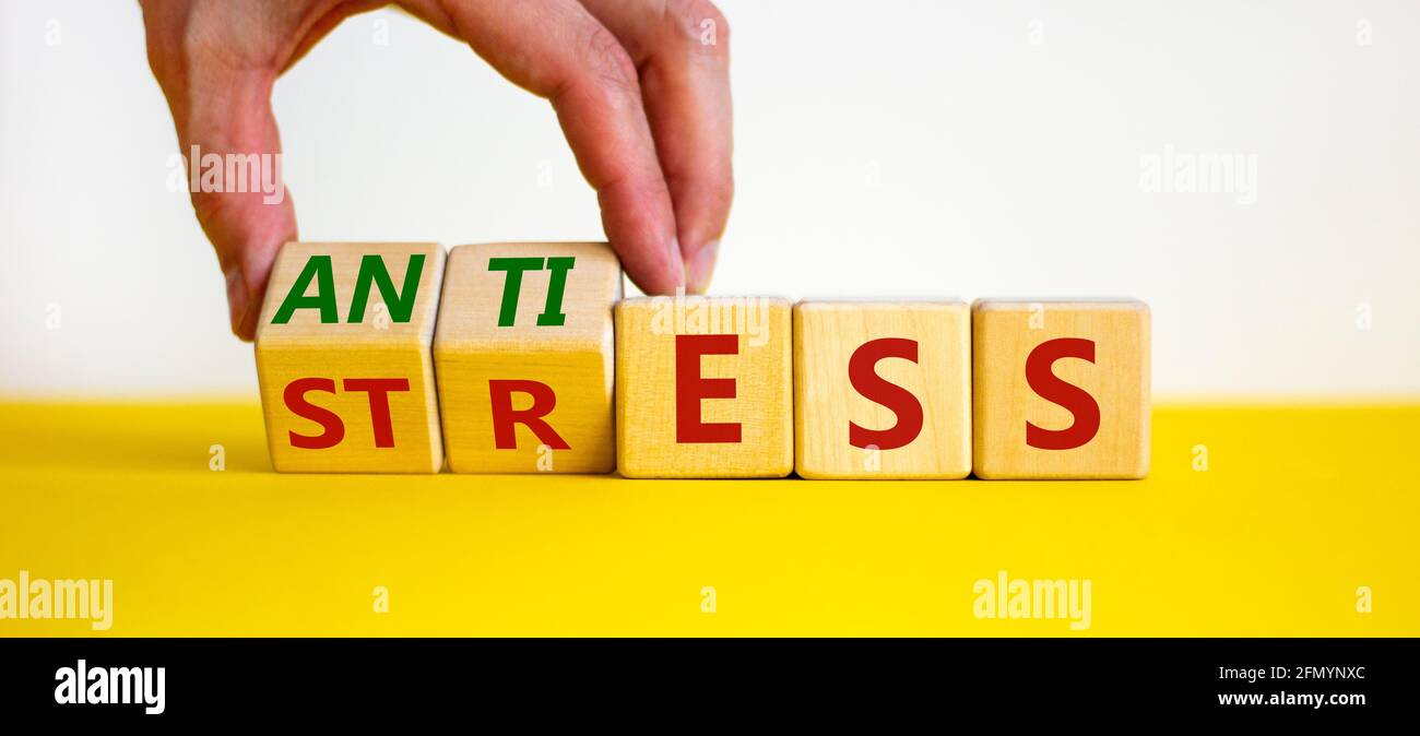 Antistress vs stress symbol. Doctor turns cubes and changes the word ...