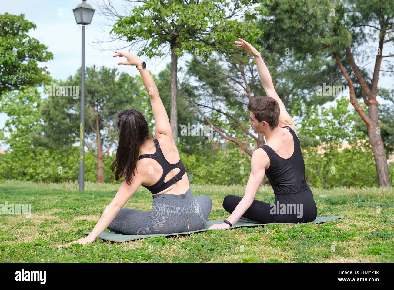 Sitting cross legged arms hi-res stock photography and images - Alamy