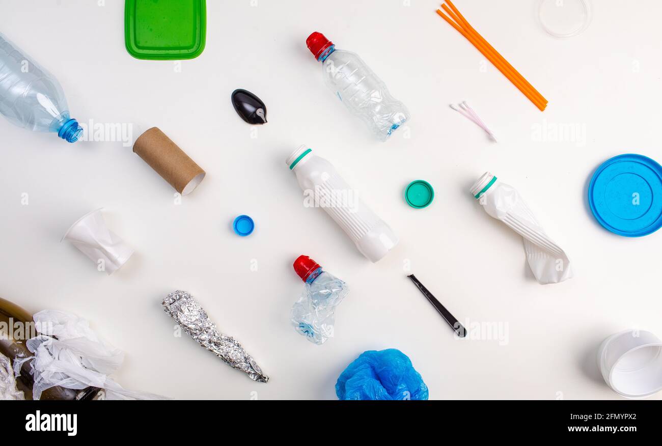 Set of plastic waste on a white background, flat lay. Concept ...