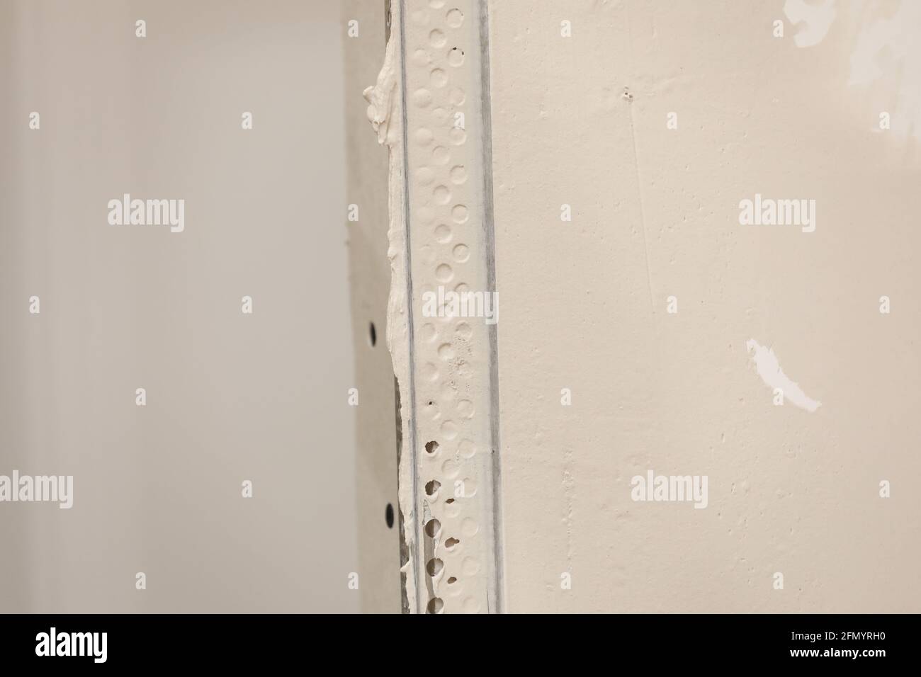 The worker set the metal wall profile in the new flat. Plasterboard ...