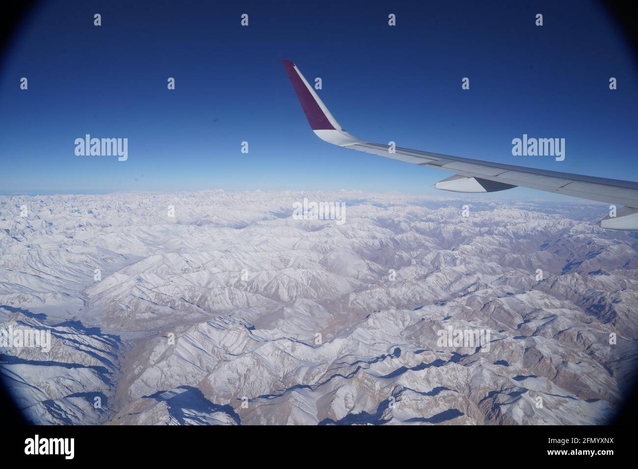 Winter mountains from the plane window Stock Photo - Alamy