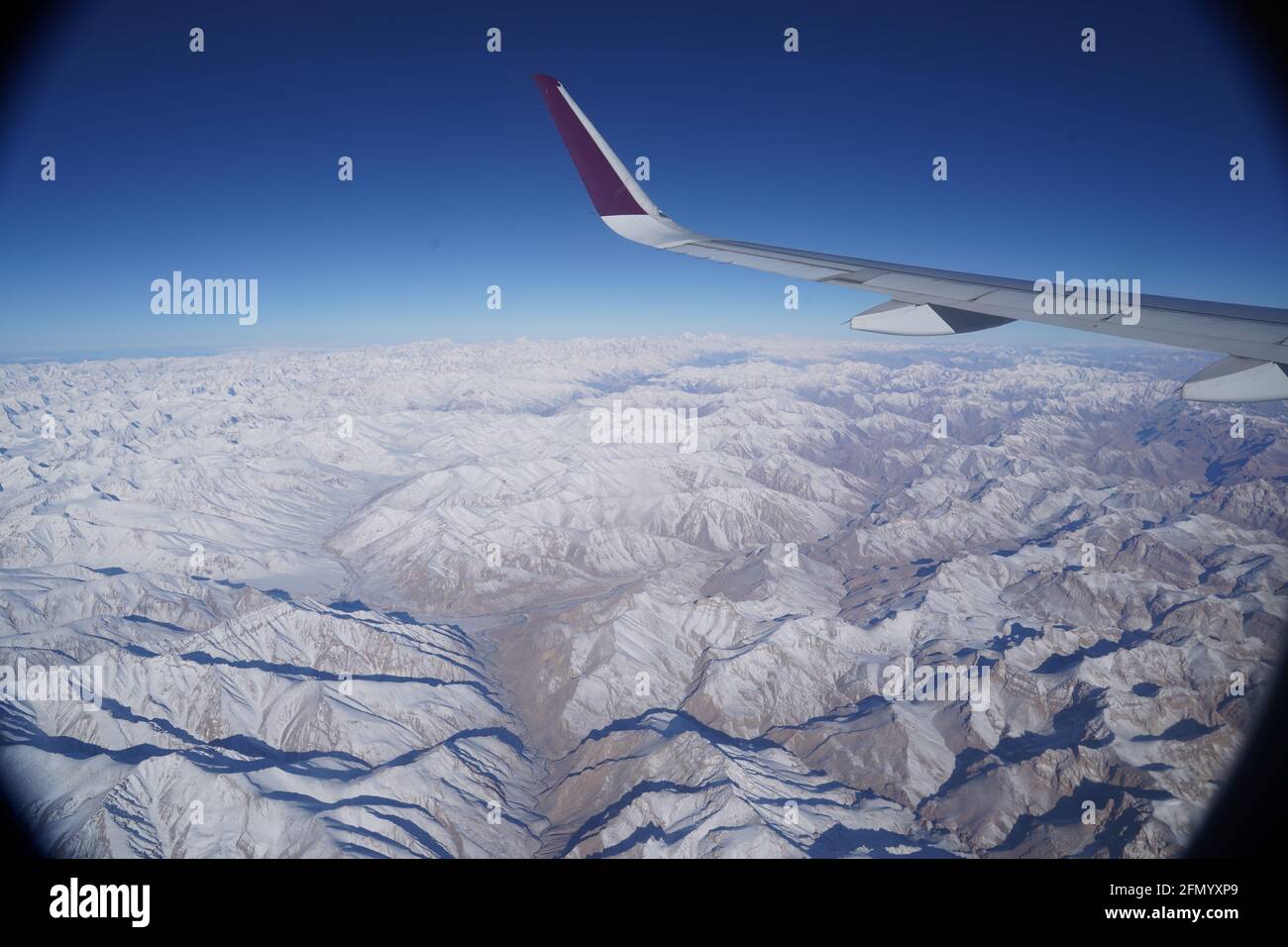 Winter mountains from the plane window Stock Photo - Alamy