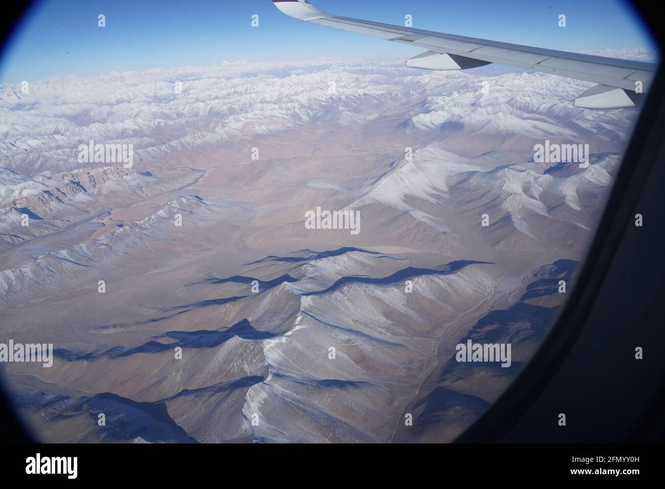 Winter mountains from the plane window Stock Photo - Alamy