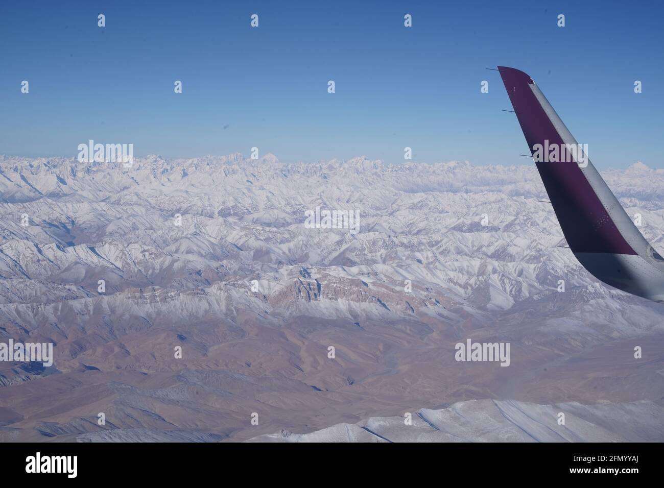 Winter mountains from the plane window Stock Photo - Alamy