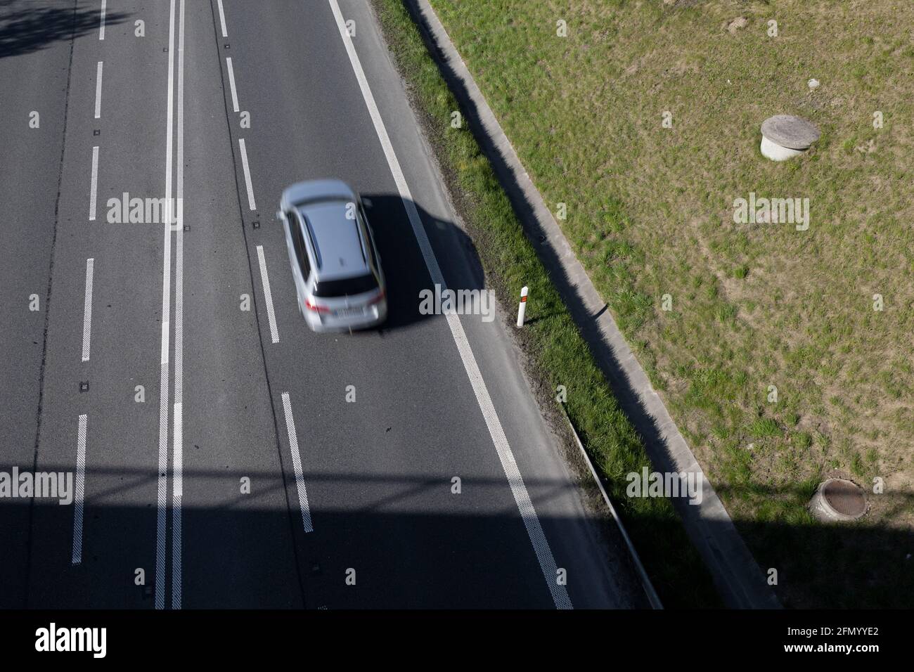 Fast unrecognizable car is going and moving on the road, roadway ...