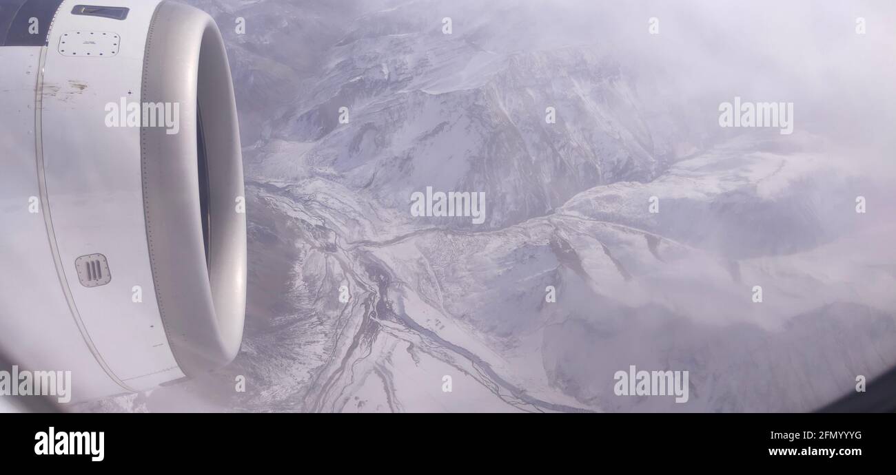 Winter mountains from the plane window Stock Photo - Alamy
