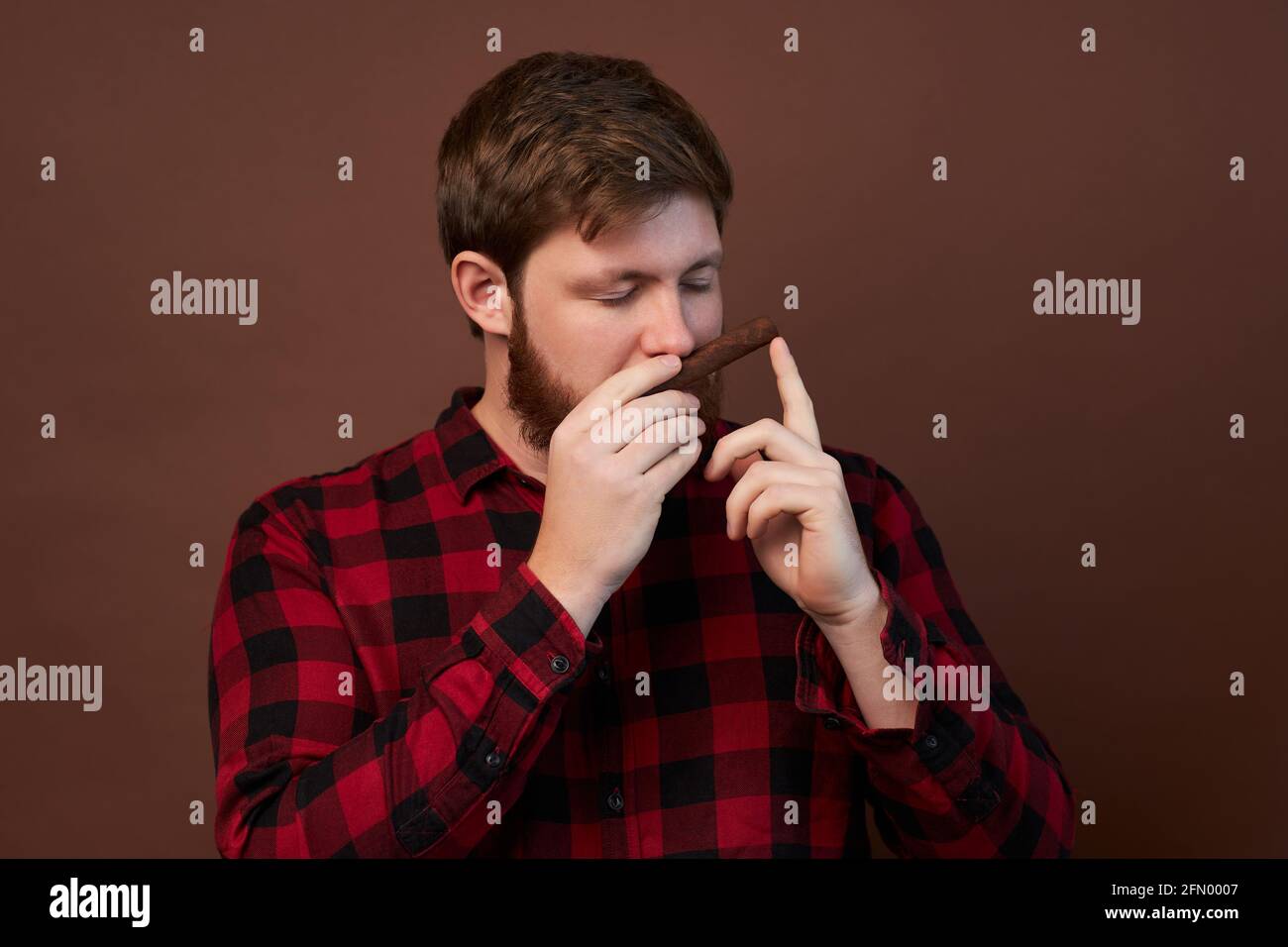 man with emotions on his face with a beard on a brown background, logo ...