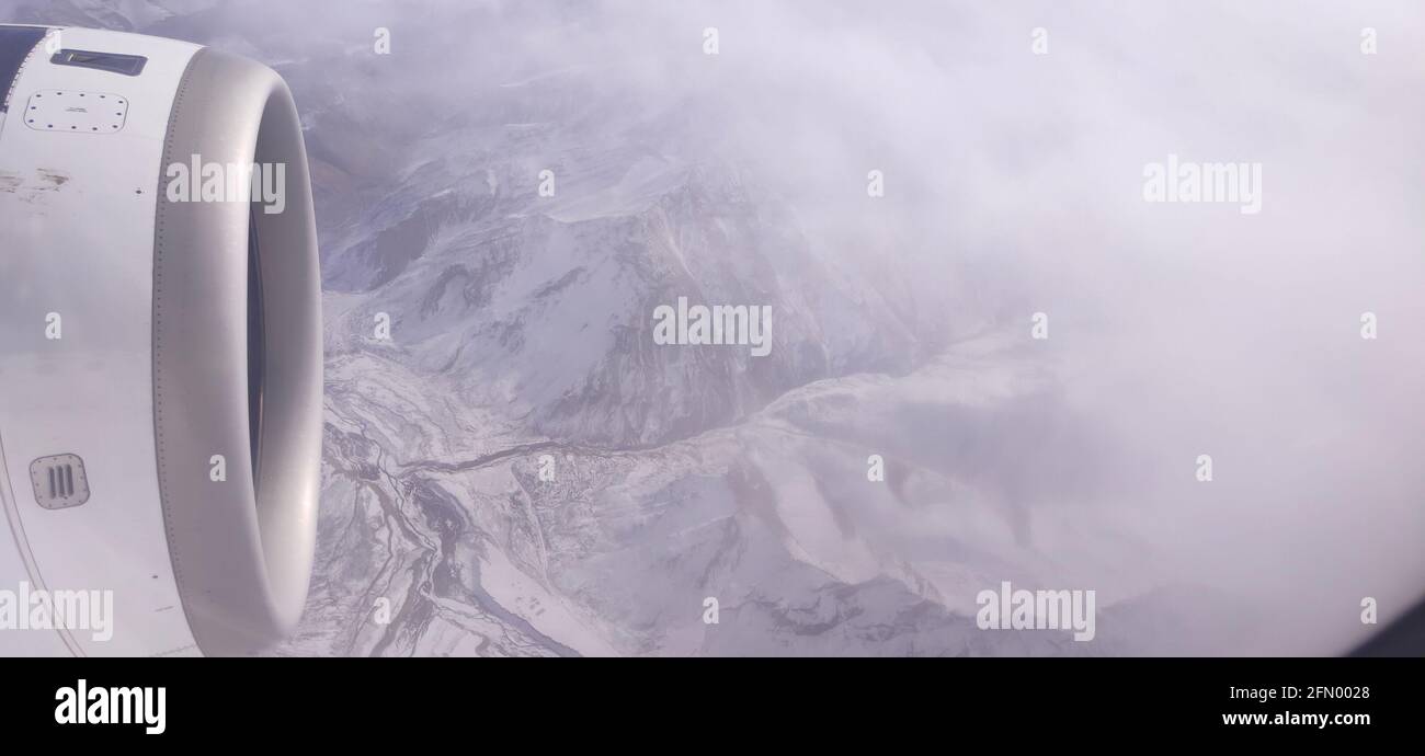 Winter mountains from the plane window Stock Photo - Alamy