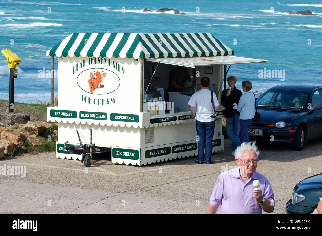 Man eating ice cream also ice cream van in Jersey Channel Islands UK ...