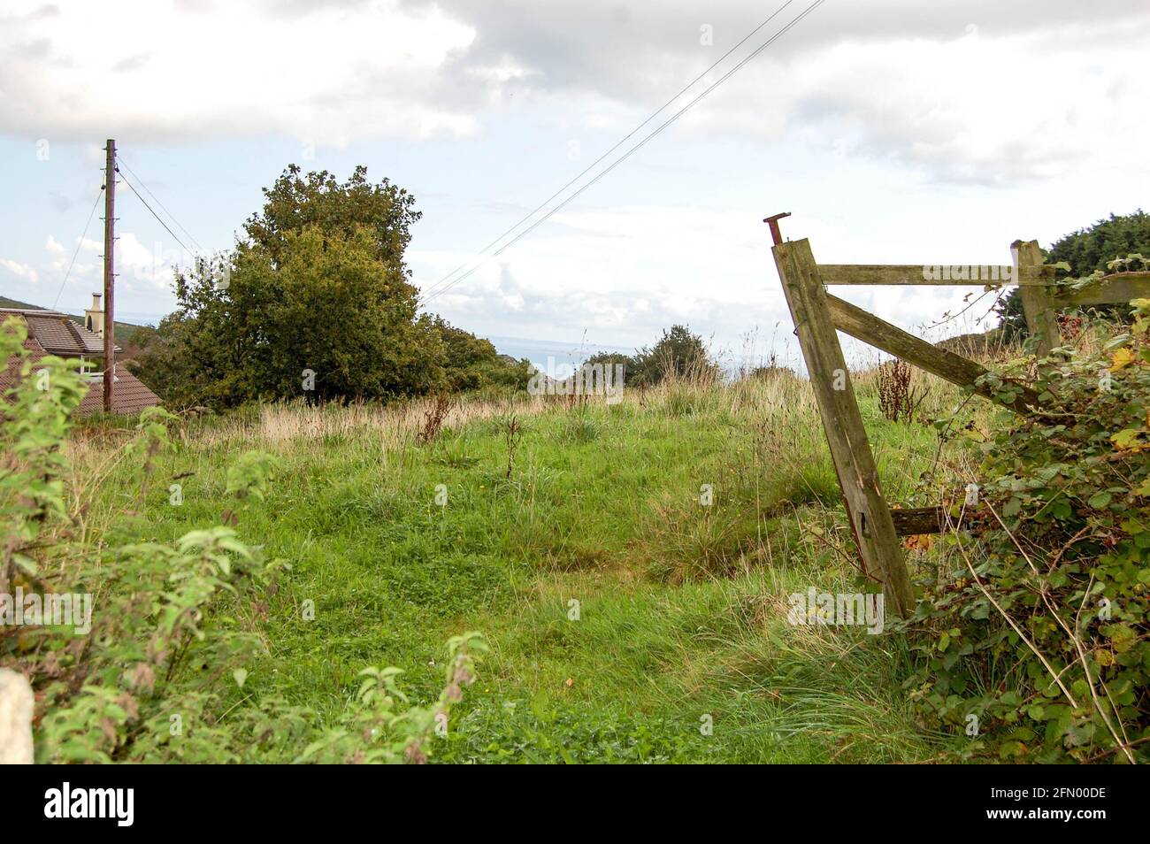 Gate and broken fence in the field Jersey Channel Islands Stock Photo ...