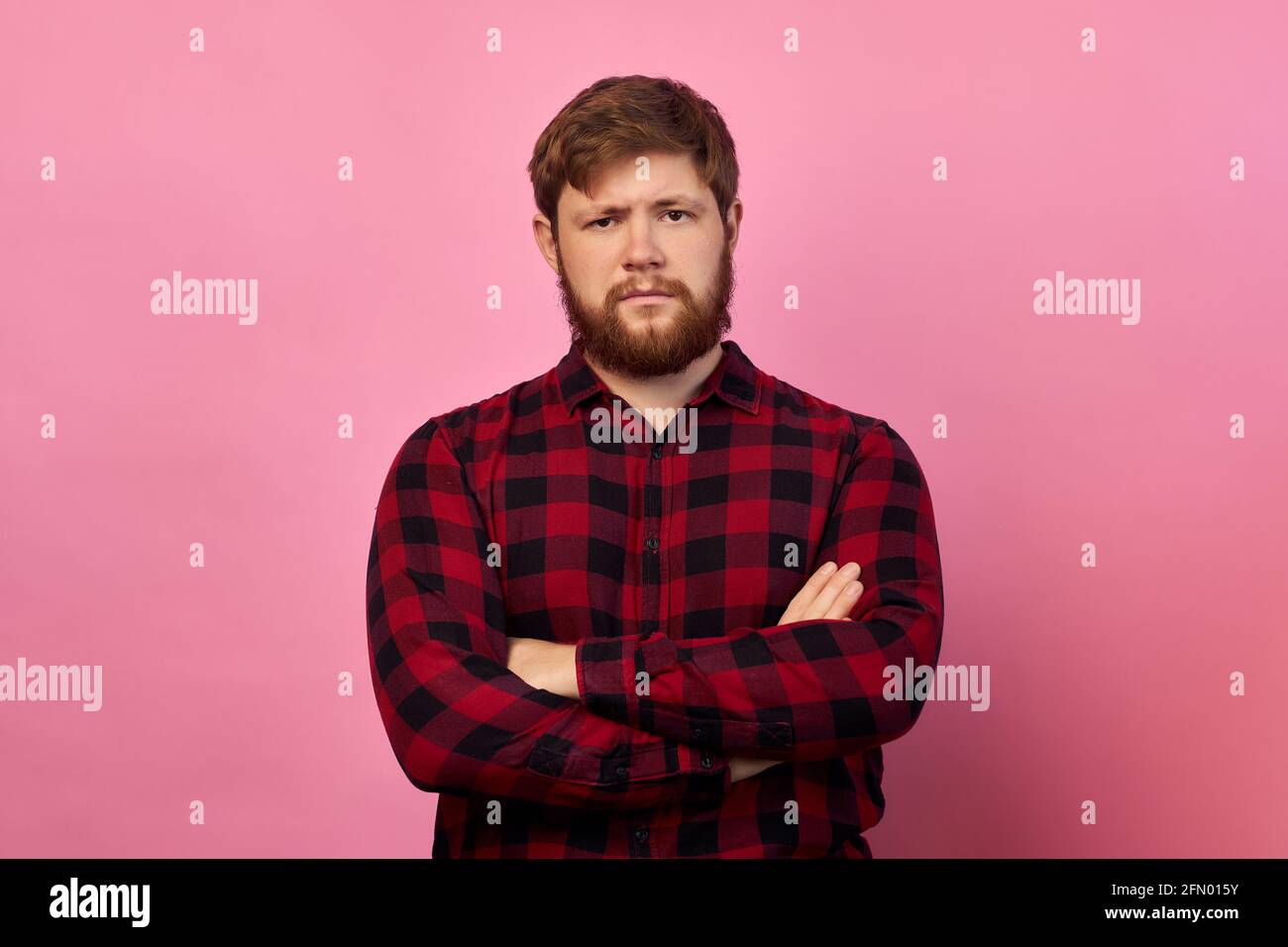 man with emotions on his face with a beard on a pink background, logo ...