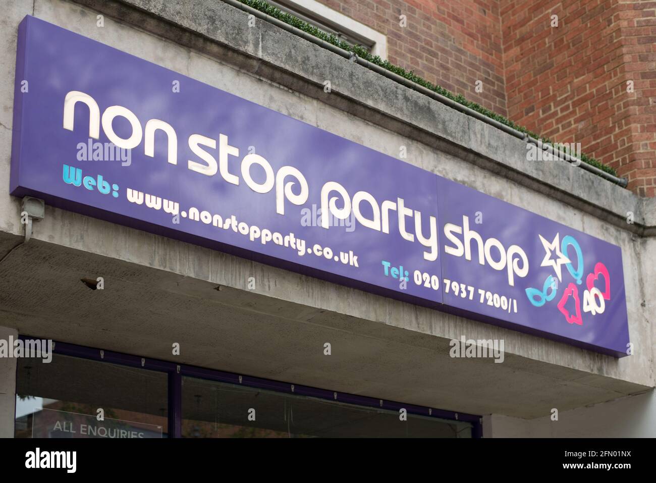 Purple Logo Shop Sign Brand Non Stop Party Shop Stock Photo - Alamy