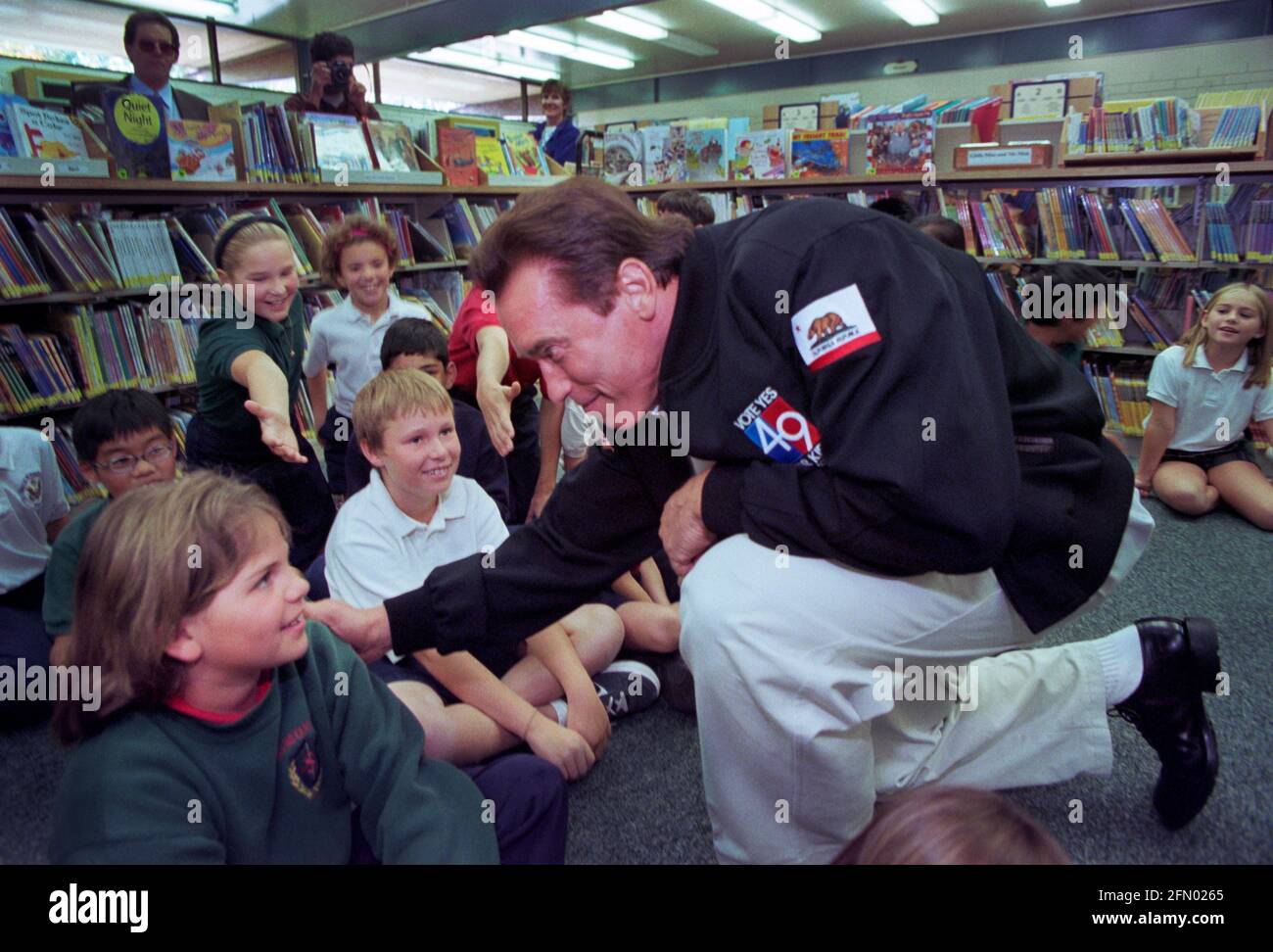 Arnold Schwarzenegger campaigning for California proposition 49, the ...