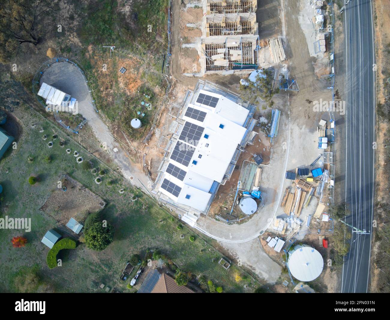 Eco sustainable homes under construction aerial view with solar panels ...