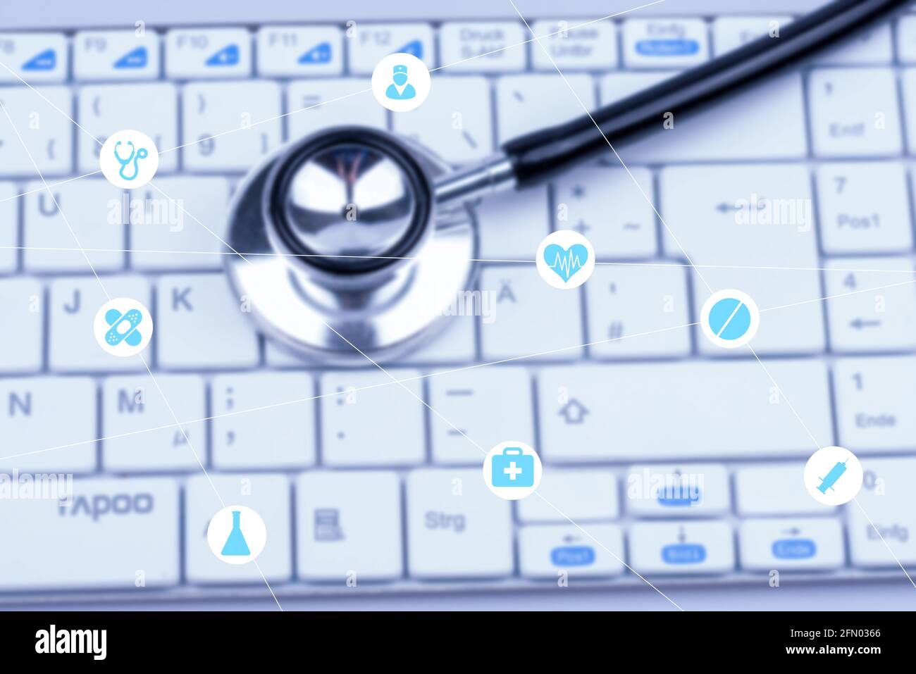 Stethoscope on a keyboard with connections of medical symbols such as ...