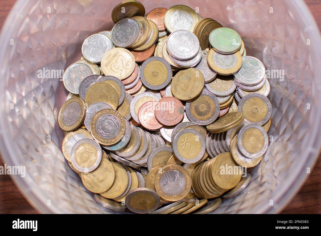 Top view of collected coins in the bowl Stock Photo - Alamy