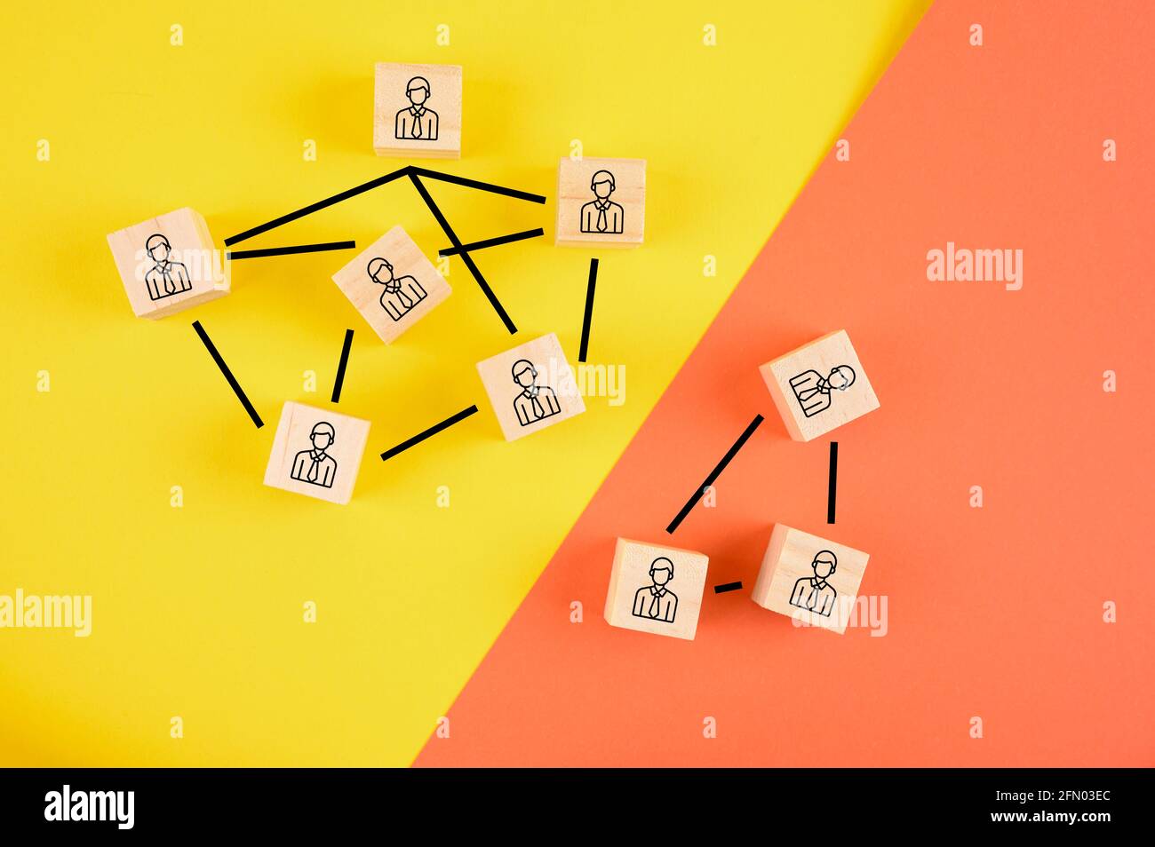 Closeup of symbols for the teams in the workplace on a yellow and ...