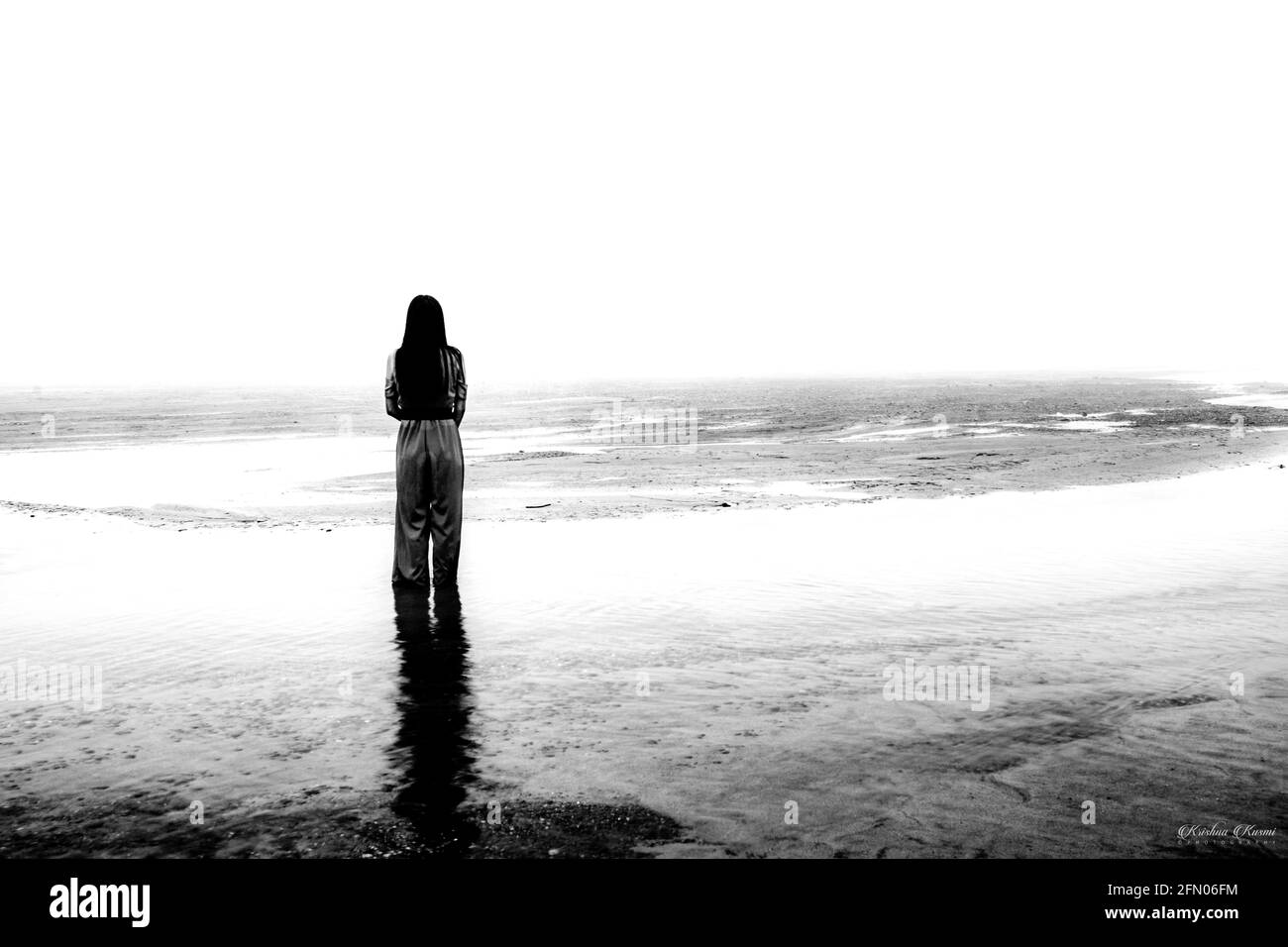 Woman back beach sad Black and White Stock Photos & Images - Alamy
