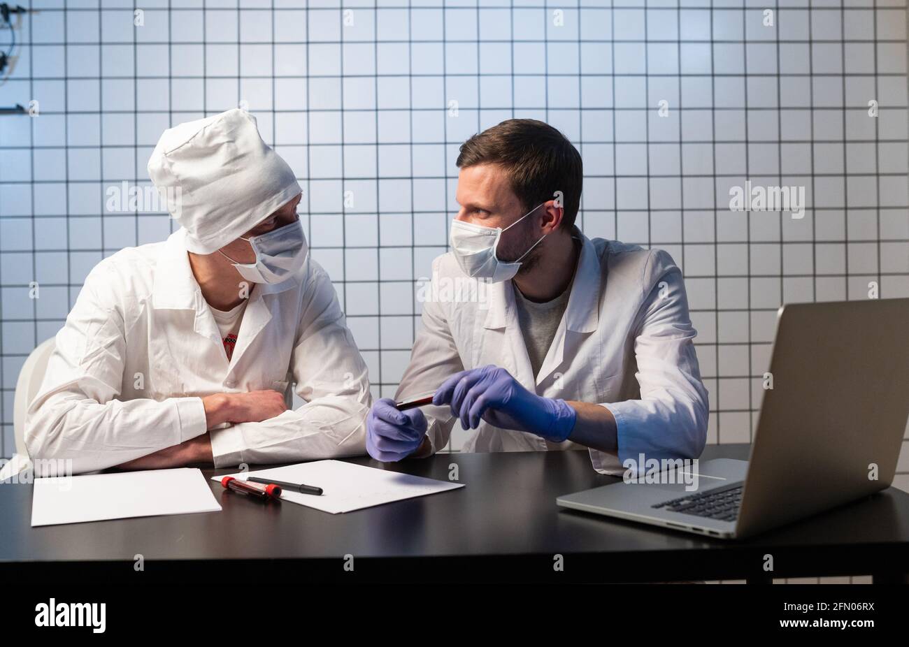 Colleagues looking computer screen in hi-res stock photography and ...