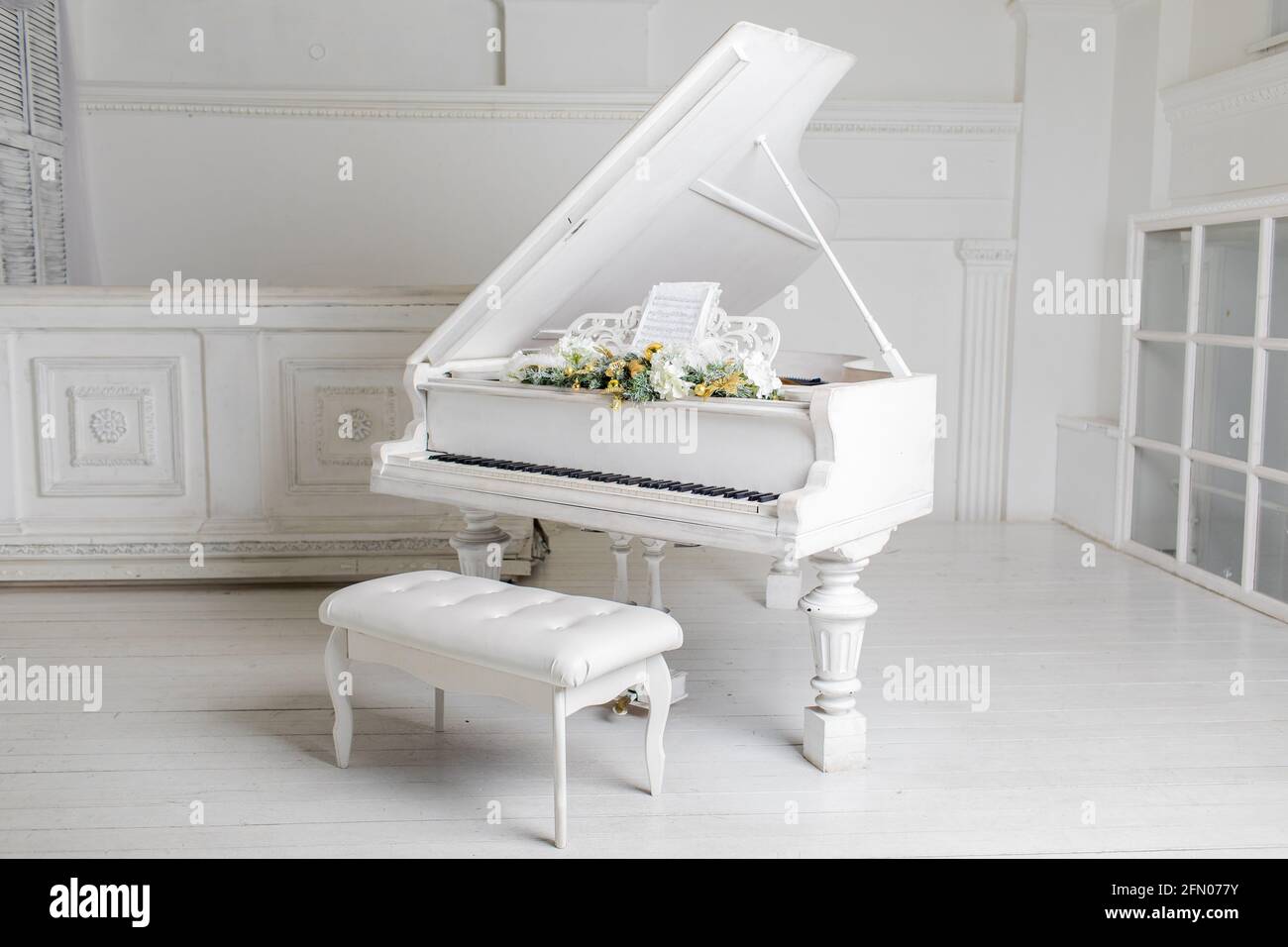 white piano in a white interior. Luxury interior Stock Photo - Alamy
