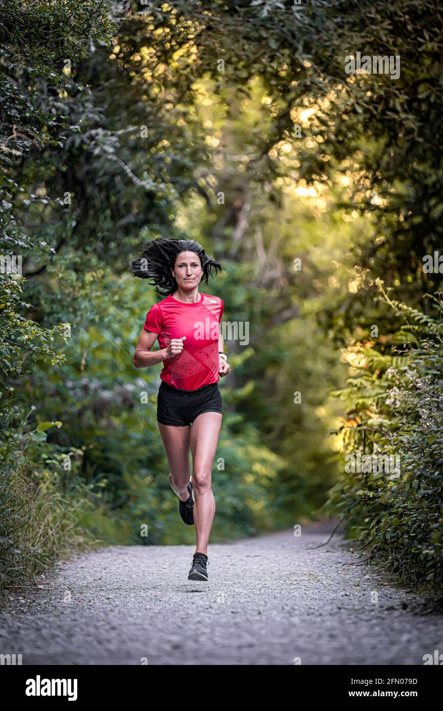Girl running in nature, it is her healthy and free lifestyle Stock ...