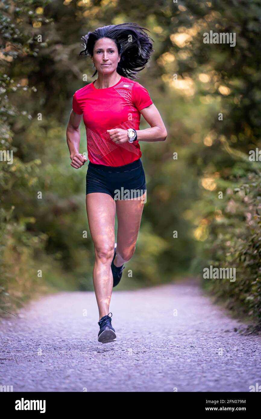 Girl running in nature, it is her healthy and free lifestyle Stock ...