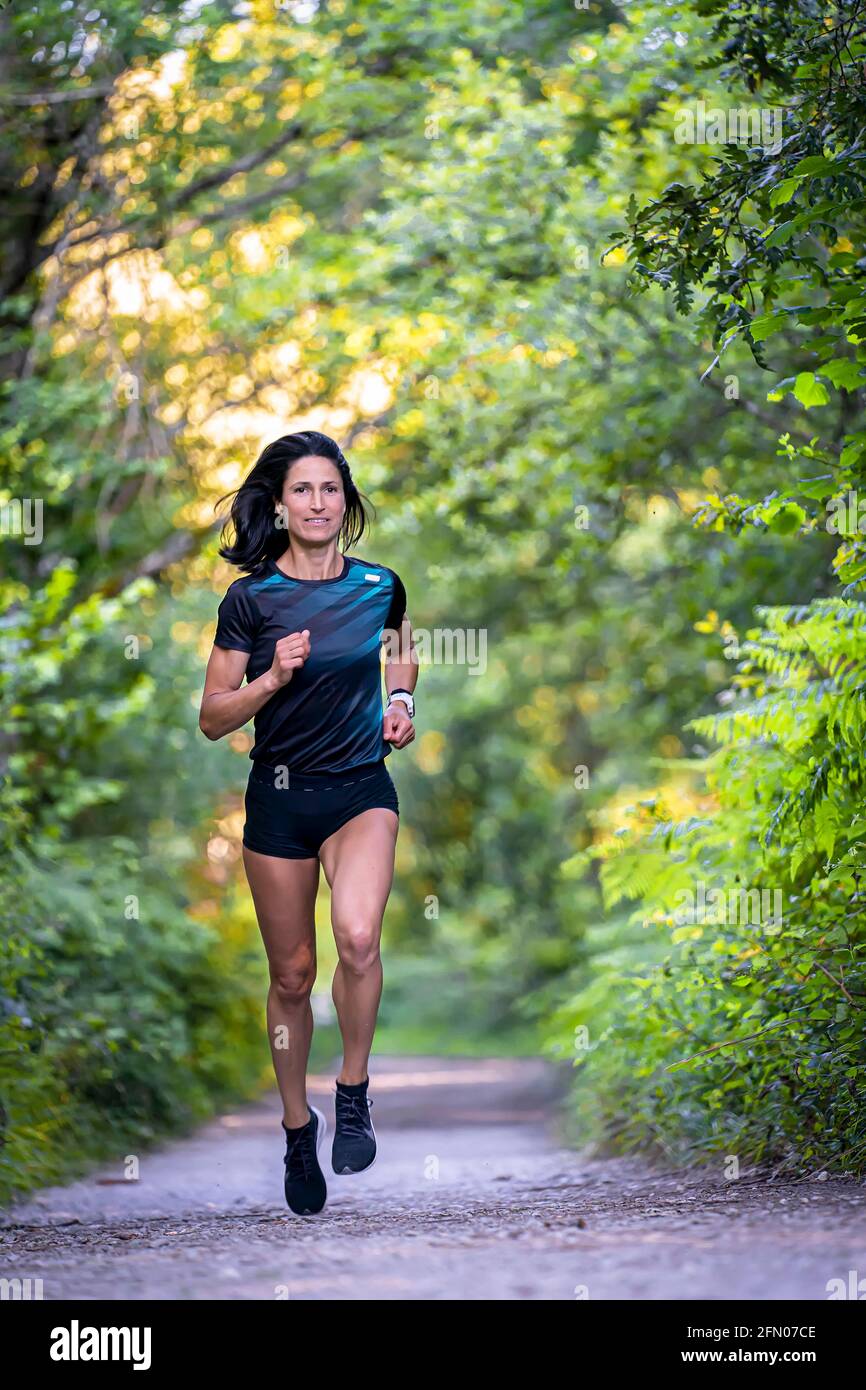Girl running in nature, it is her healthy and free lifestyle Stock ...