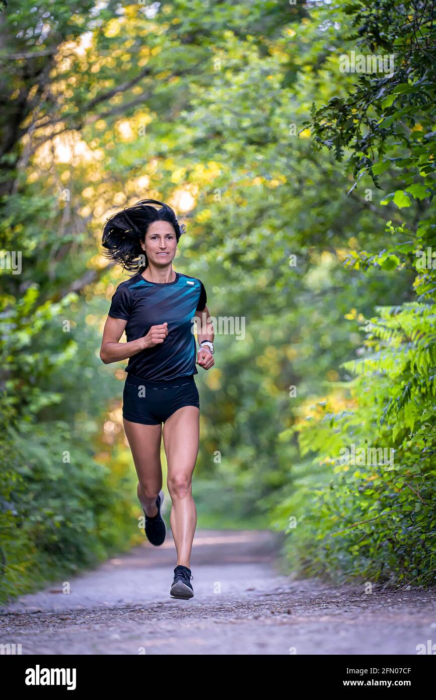 Girl running in nature, it is her healthy and free lifestyle Stock ...
