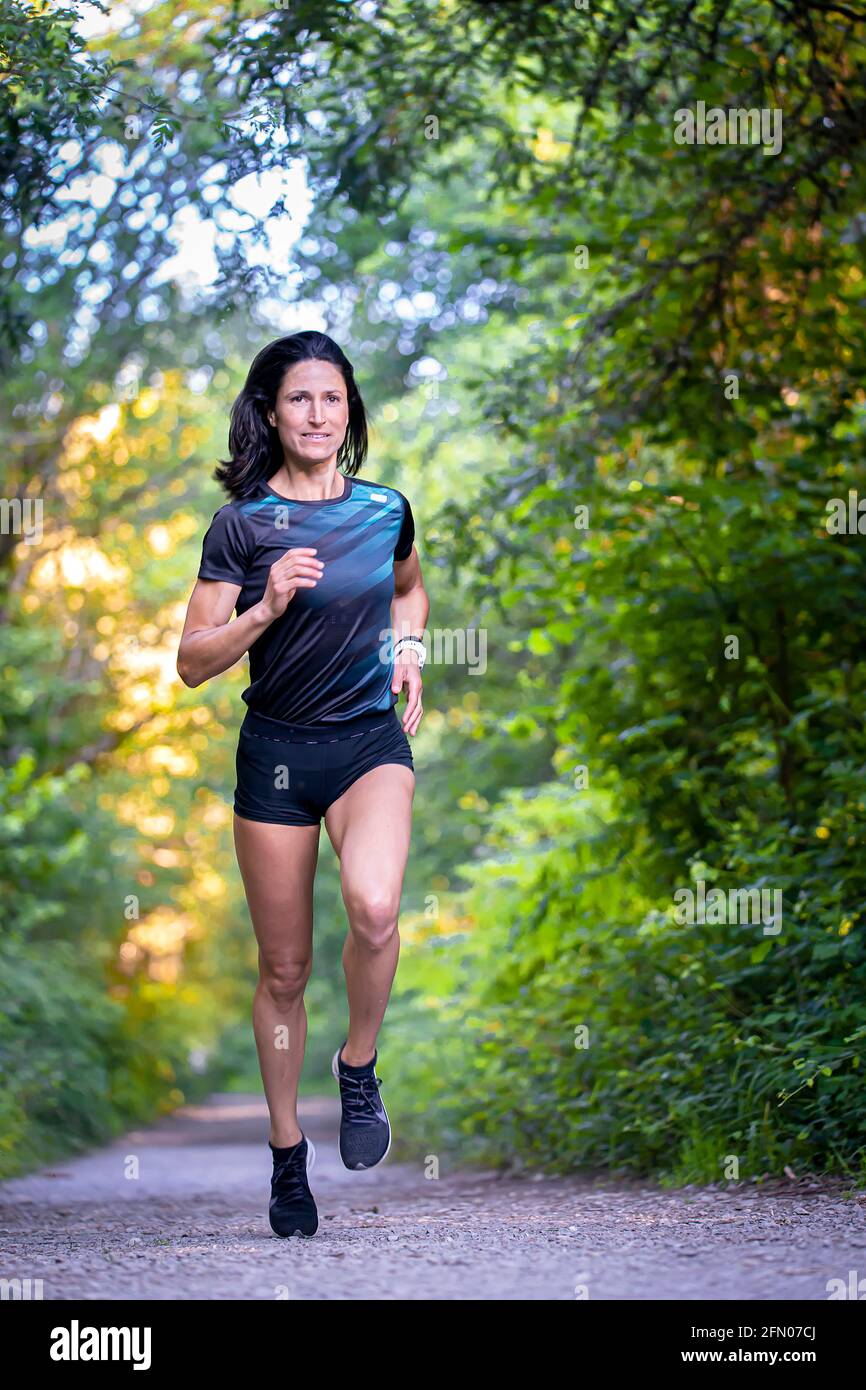 Girl running in nature, it is her healthy and free lifestyle Stock ...