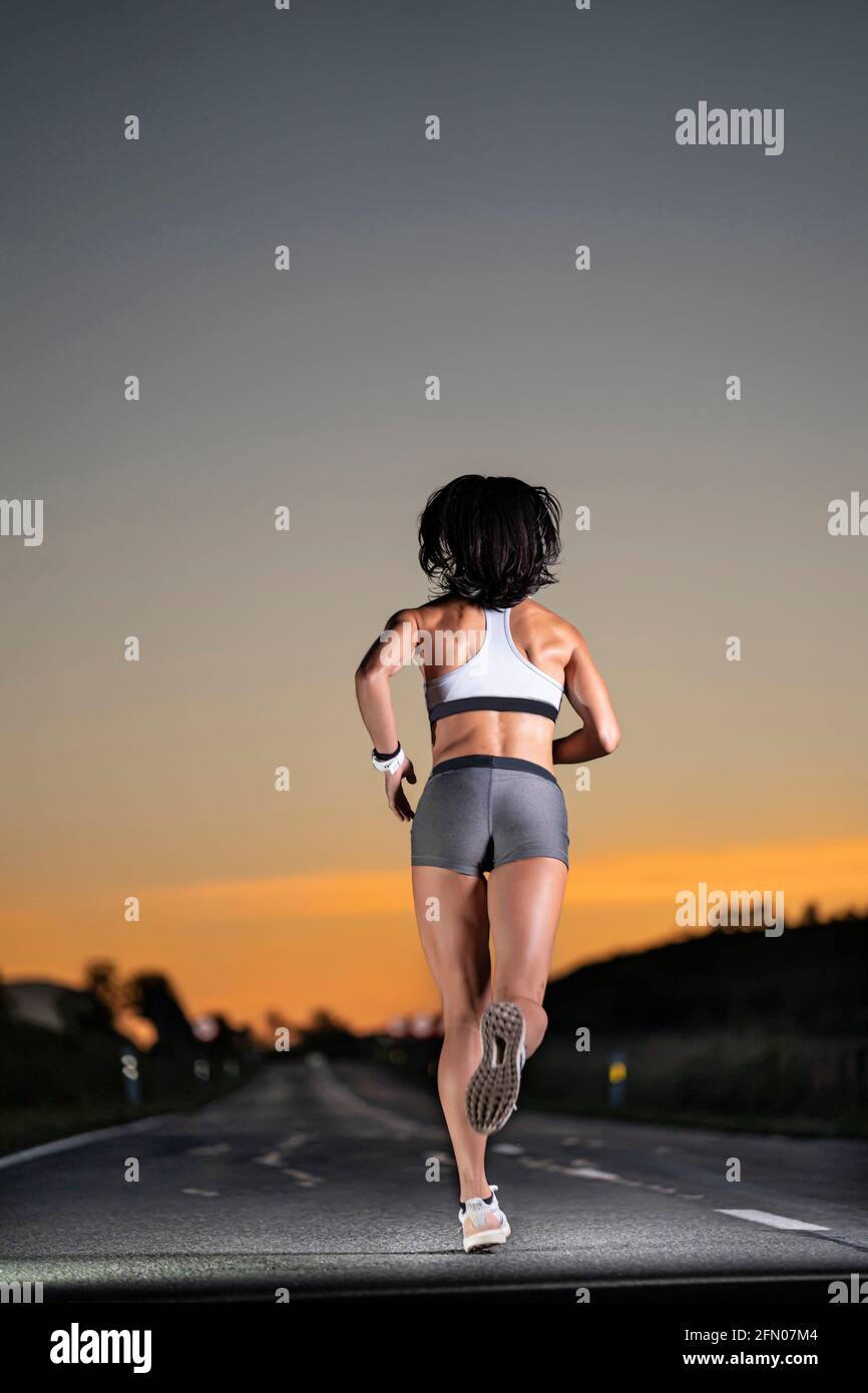 Girl running in nature and with sunset, it is her free and healthy ...