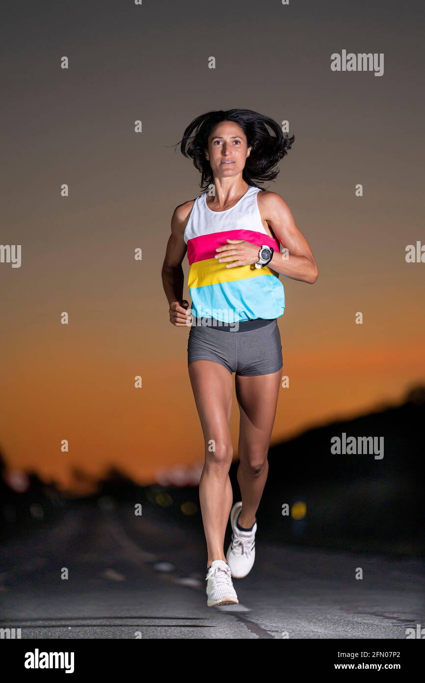 Girl running in nature and with sunset, it is her free and healthy ...