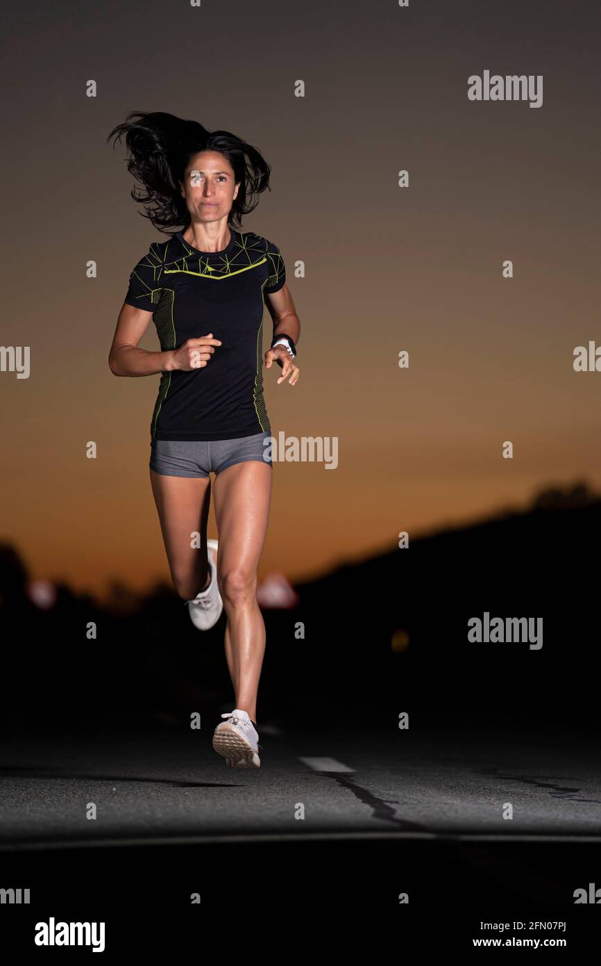 Girl running in nature and with sunset, it is her free and healthy ...