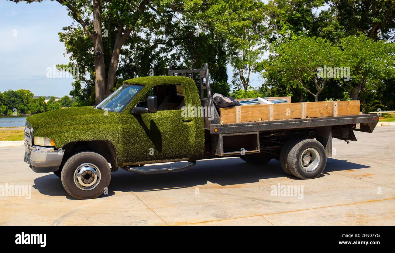 Flatbed truck with artificial turf glued on the cab and wooden ...