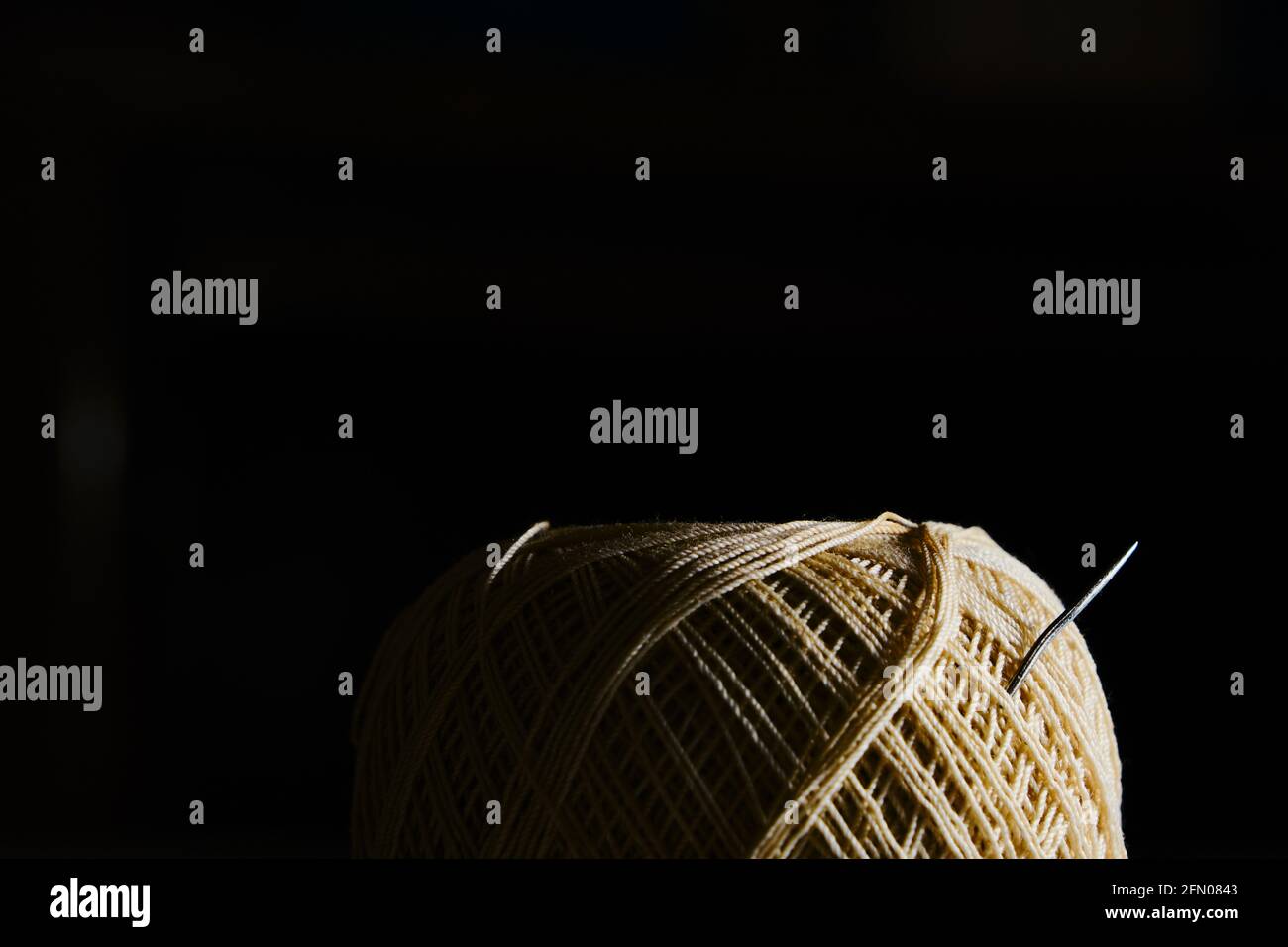 Needle and yellow thread with black background Close up Needle and ...